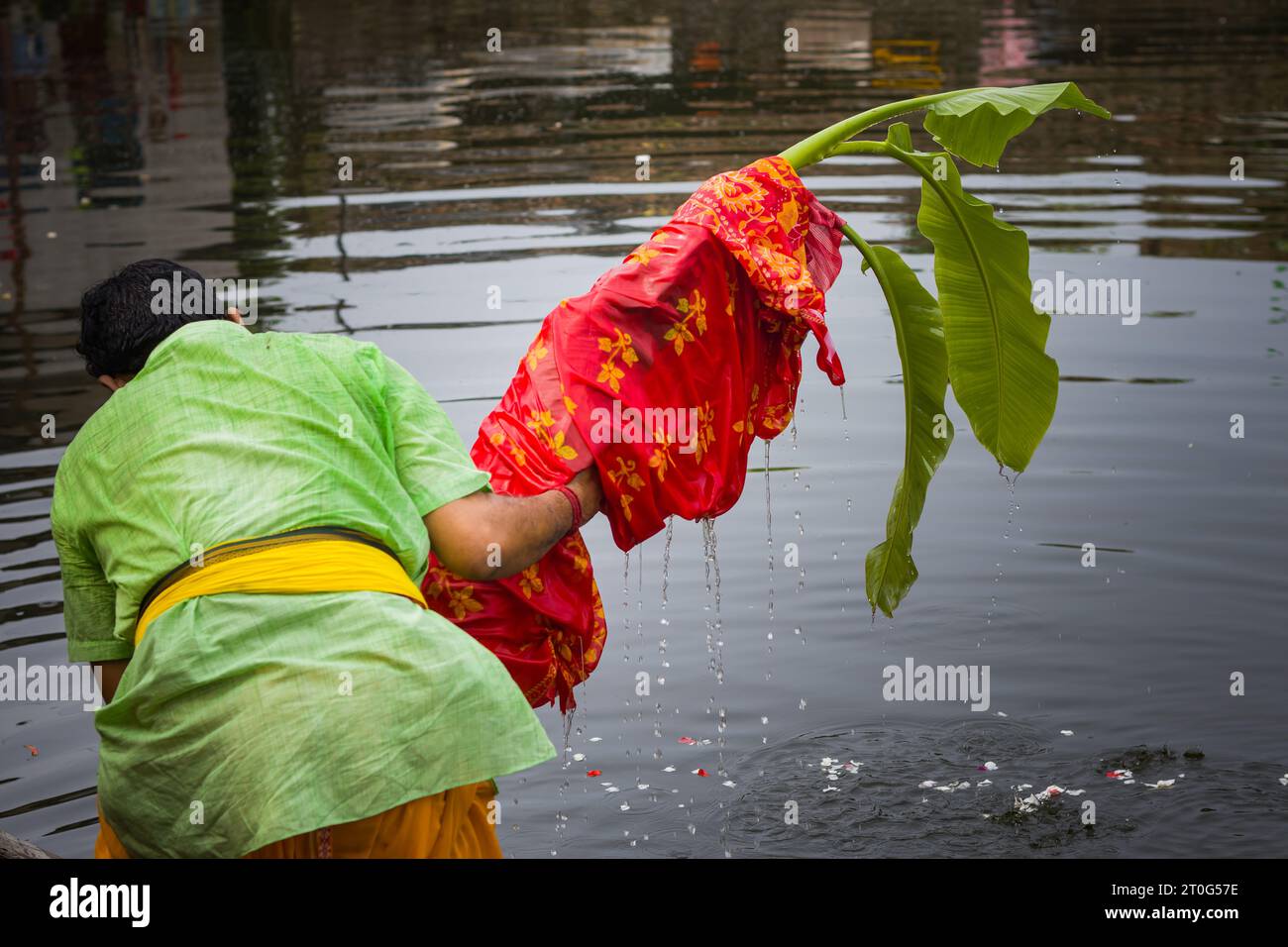 Durga puja ritual of bathing the banana plant. This rite is called ...