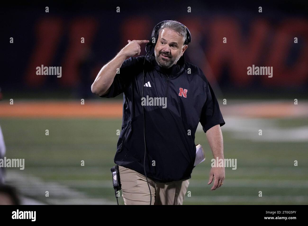 Nebraska coach Matt Rhule points to his headset as he walks the ...