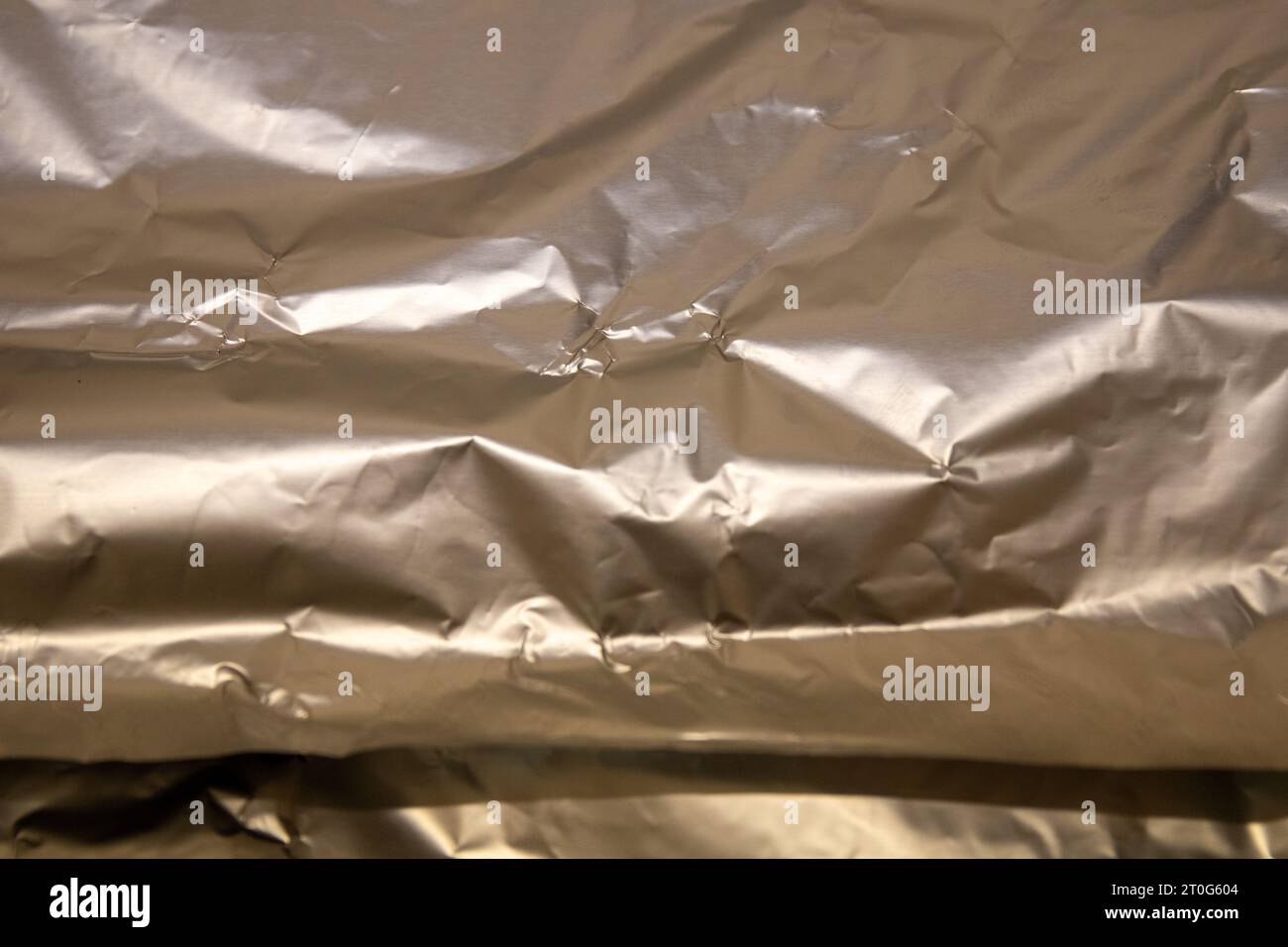Aluminum foil sheet ready for wrapping or covering Stock Photo - Alamy