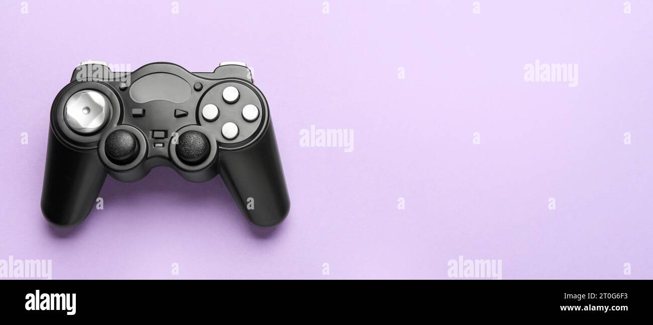 Modern controller on lilac background with space for text Stock Photo ...