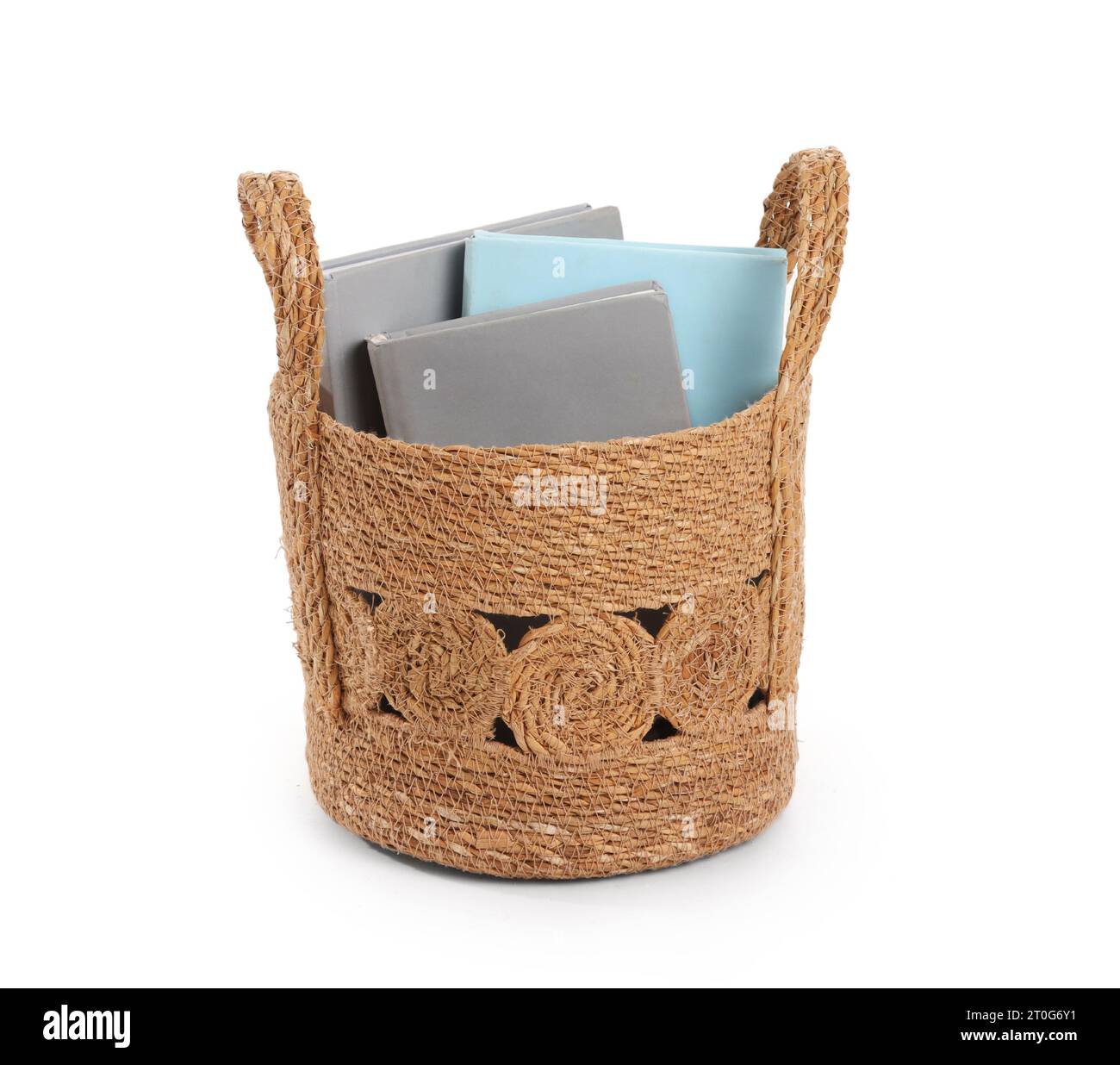 Wicker basket with books isolated on white background Stock Photo - Alamy