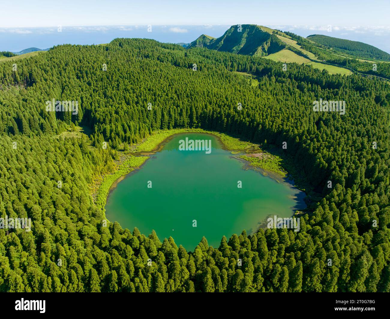 Aerial view of "Lagoa do Canario" lagoon surrounded by green forest ...