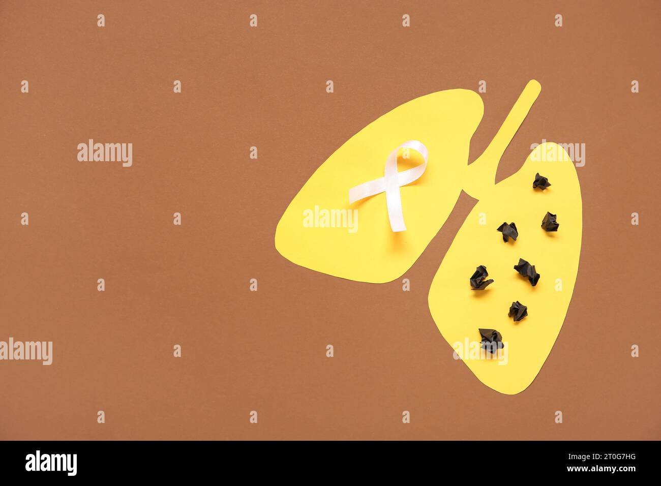Paper lungs with white ribbon and tumors on brown background. Lung ...