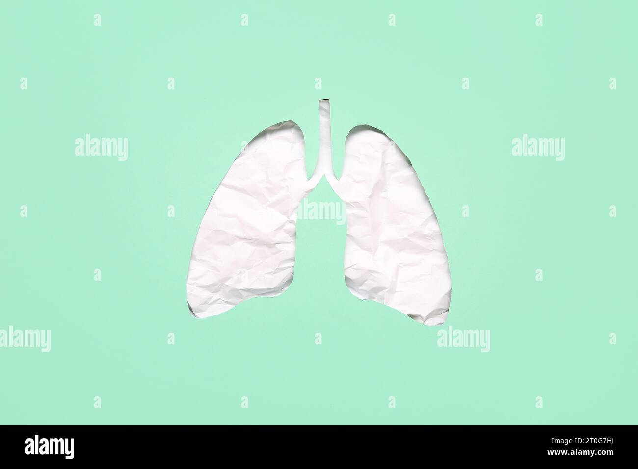 Cut out paper lungs on turquoise background. Lung cancer concept Stock ...