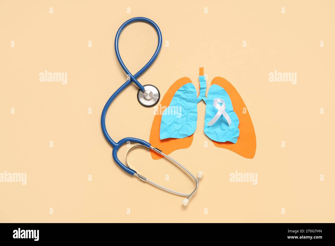 Paper lungs with white ribbon and stethoscope on beige background. Lung ...
