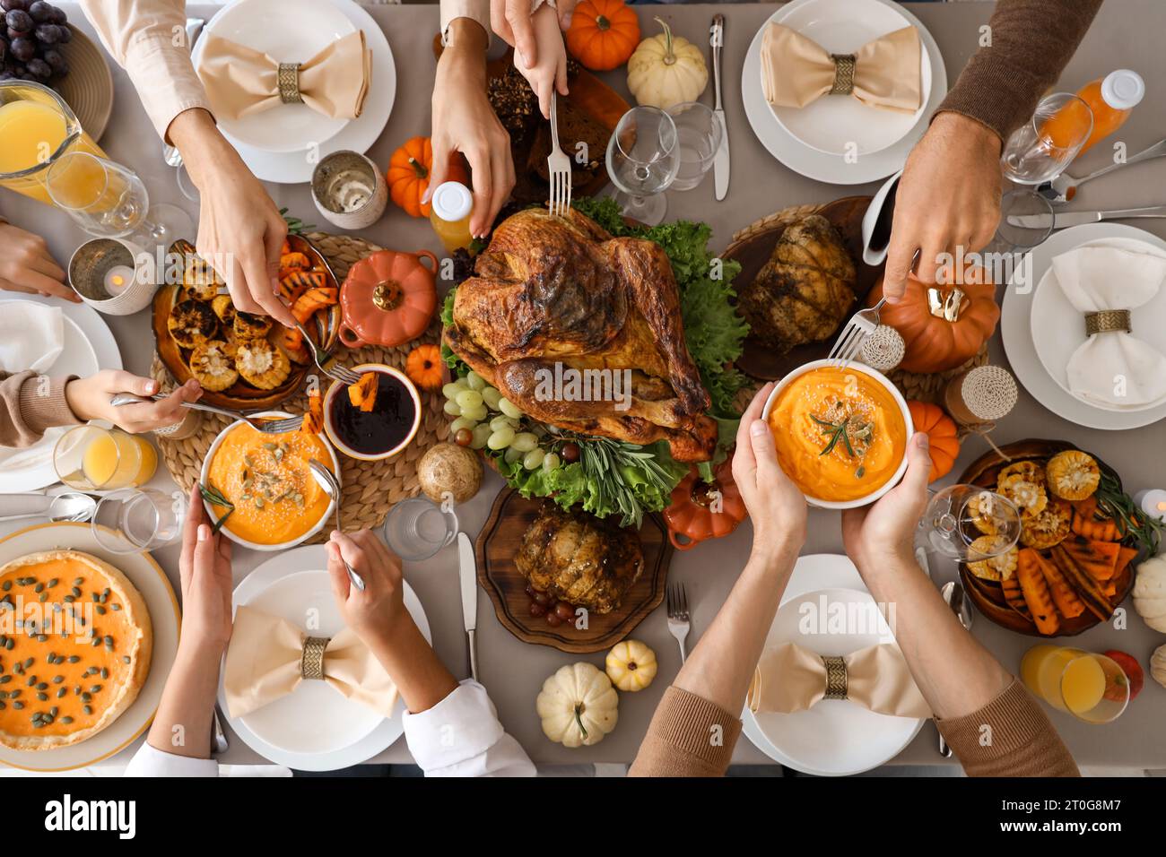 Happy family having dinner at festive table on Thanksgiving Day, top ...