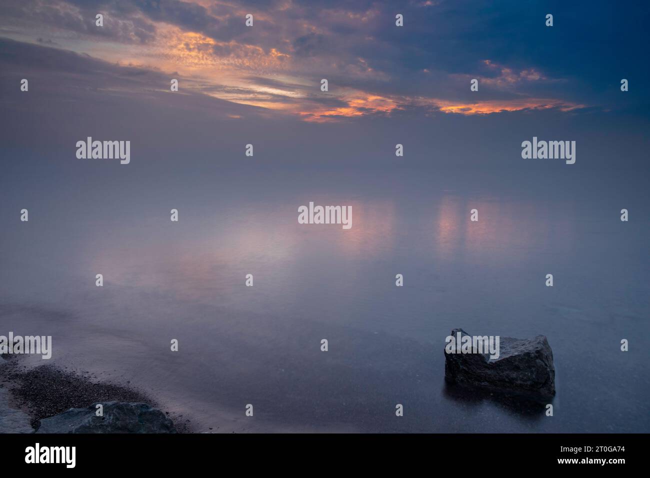 Landscape of a cloudy sunrise on Lake Huron from July 2, 2023 Stock ...