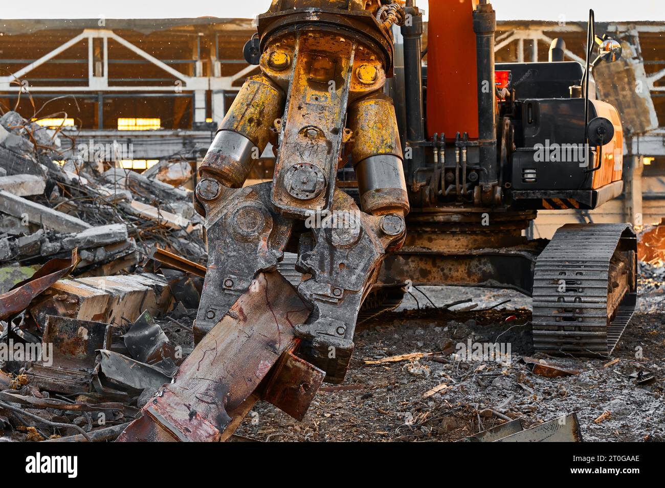 Hydraulic breaking shears cut through the steel beam. Demolition of ...