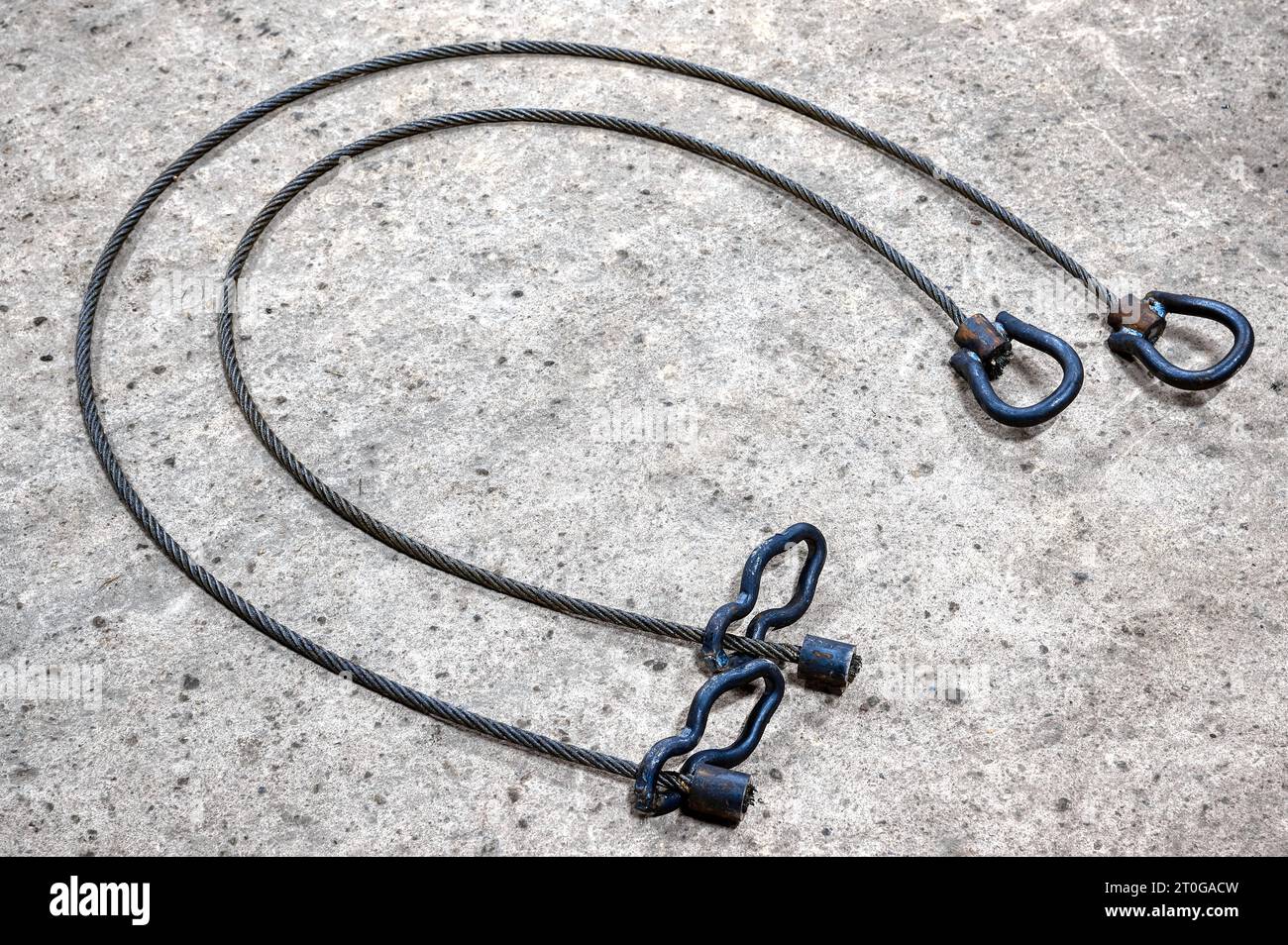 Wire rope sling with eyeloops on ends on concrete surface Stock Photo ...