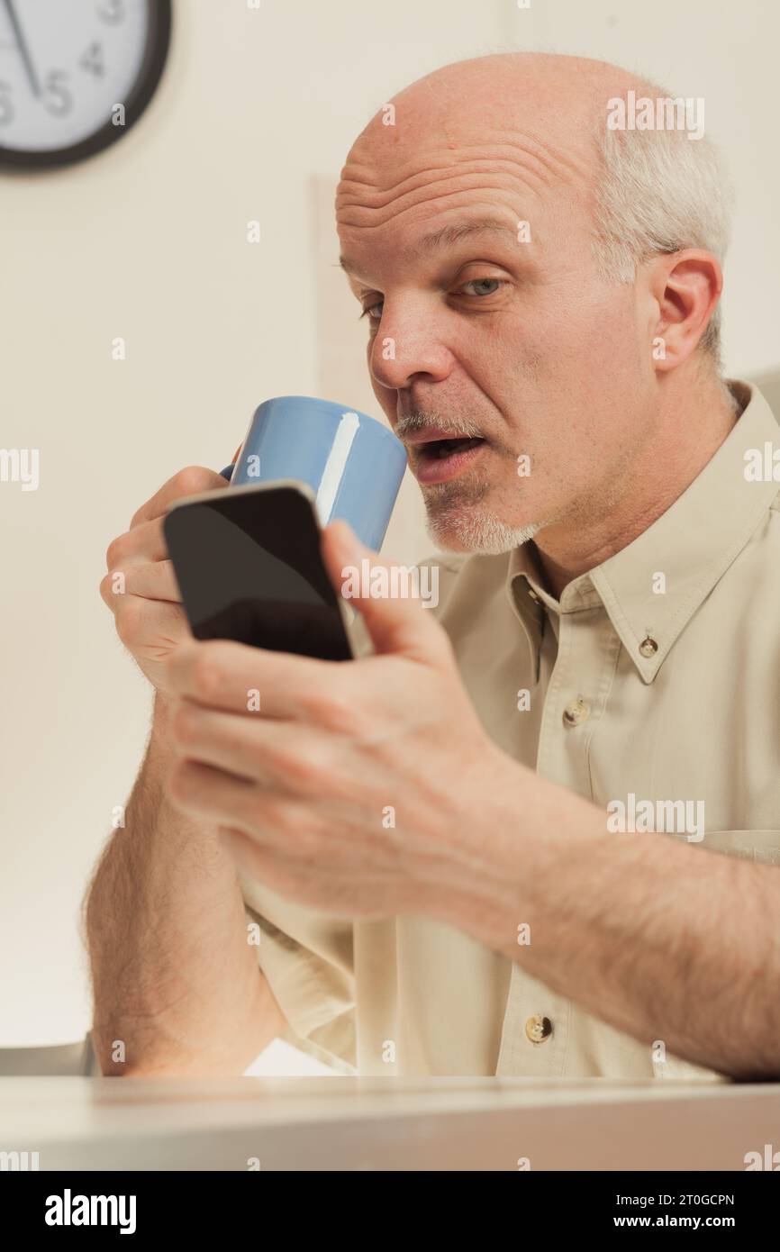 Elderly man appreciates modern tech, uses devices during breaks. Past ...