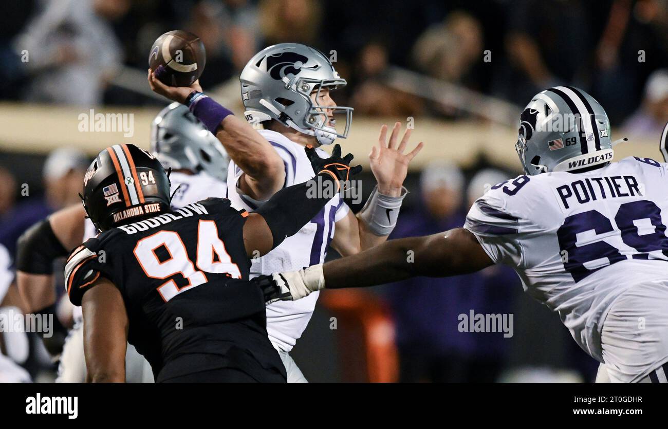 Kansas State offensive lineman Taylor Poitier (69) reaches to stop ...