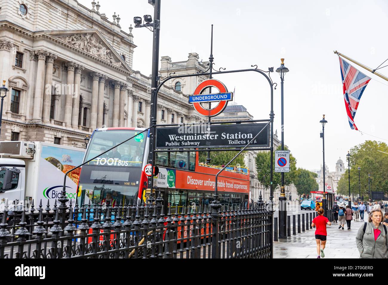 London, Westminster underground sign, Union Jack and red London bus ...