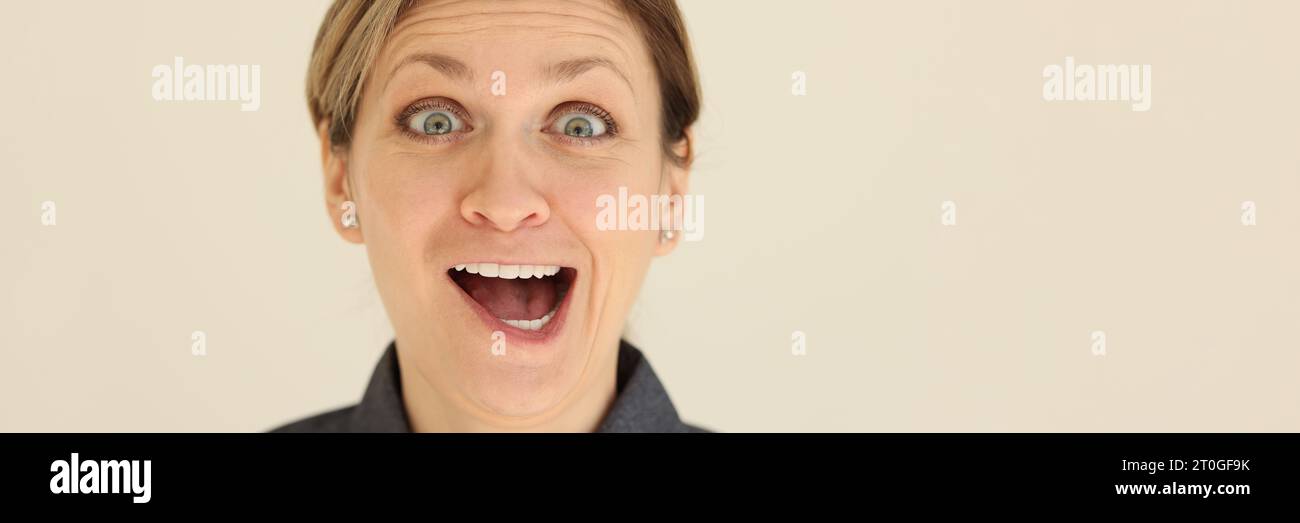 Woman with active facial expressions grimaces at camera Stock Photo - Alamy