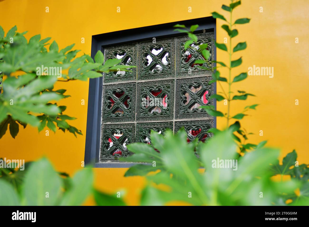 Photo of a traditional style window on the wall of a Chinese temple ...