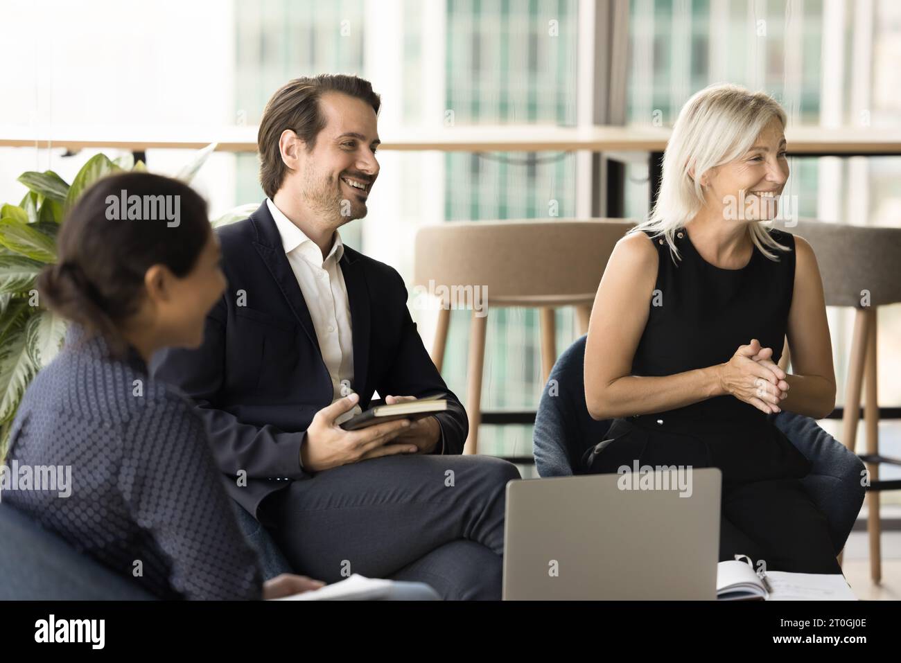 Happy positive diverse business team meeting in office lobby Stock ...