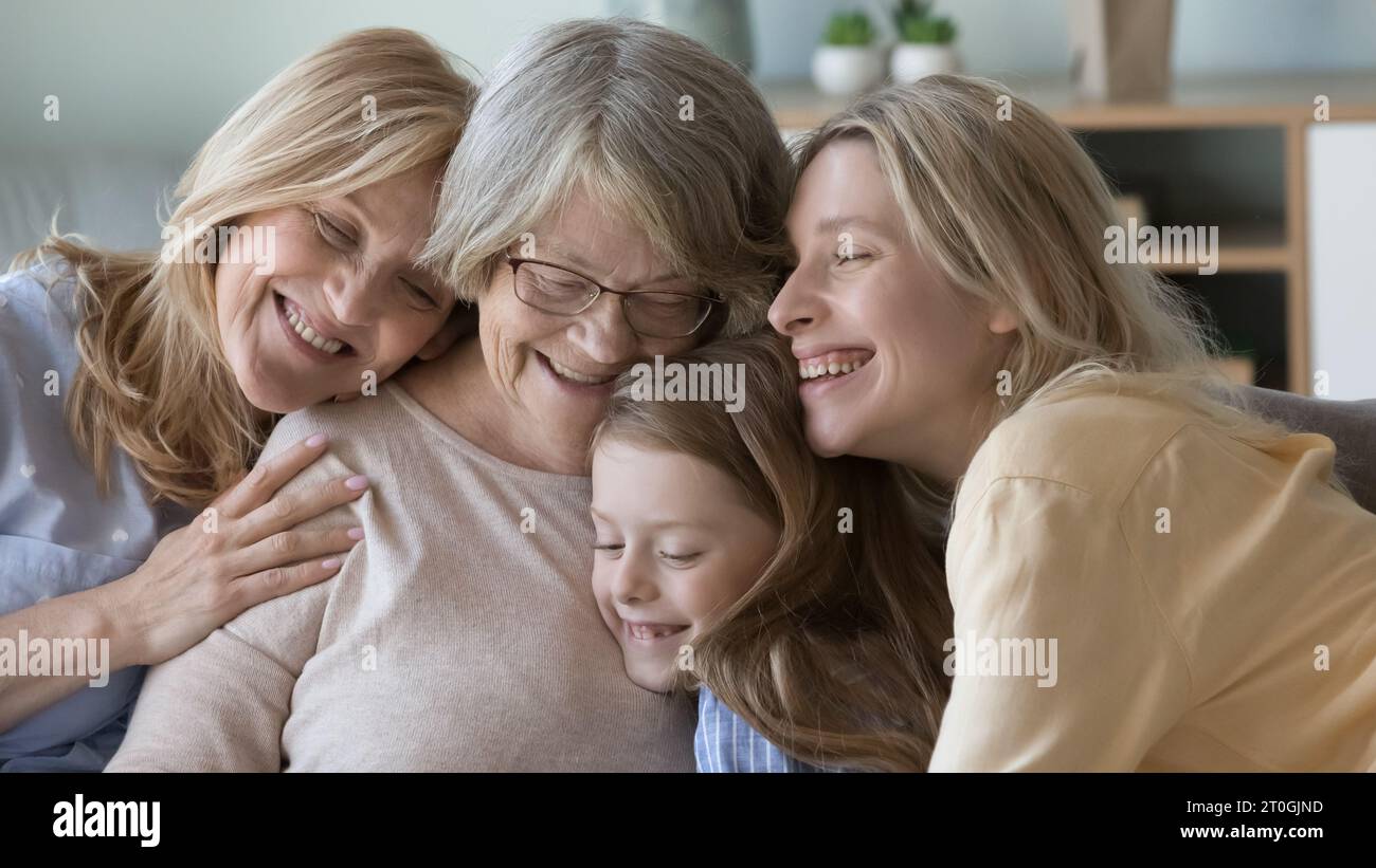 Happy cheerful girls and women of different family generations Stock ...