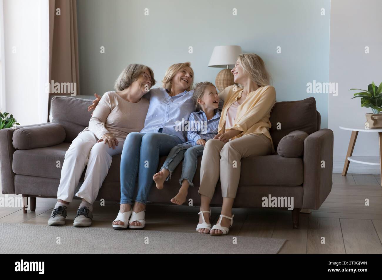 Four young women sofa sit hi-res stock photography and images - Alamy