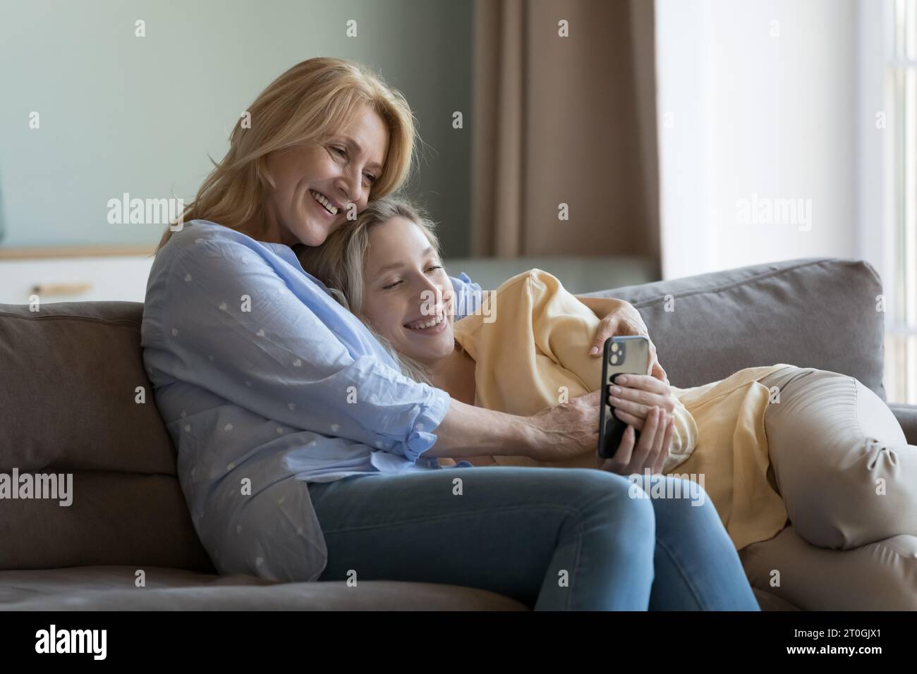 Mom talking on phone daughter hi-res stock photography and images - Alamy