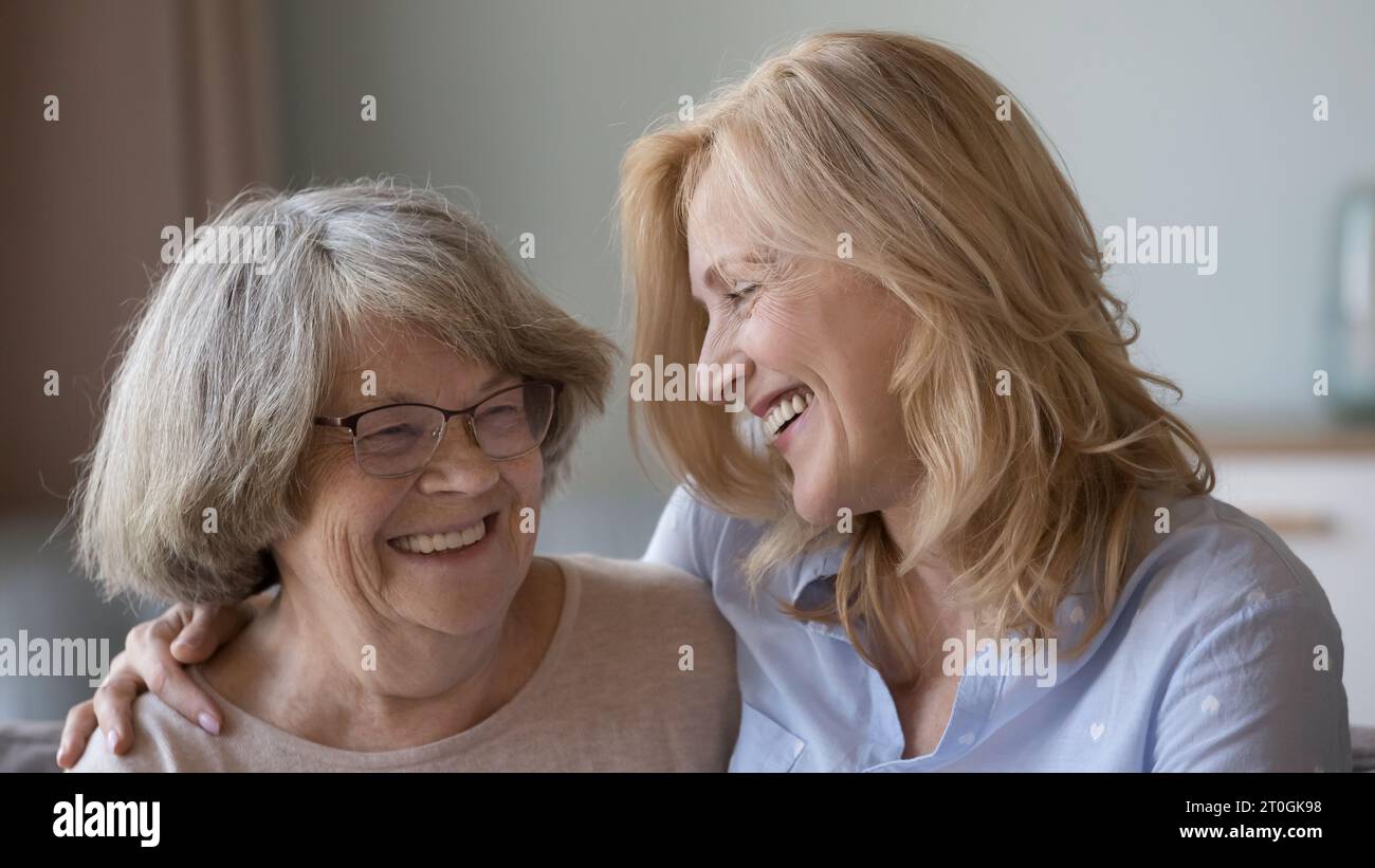 Cheerful elder 80s mother and grownup mature daughter Stock Photo - Alamy