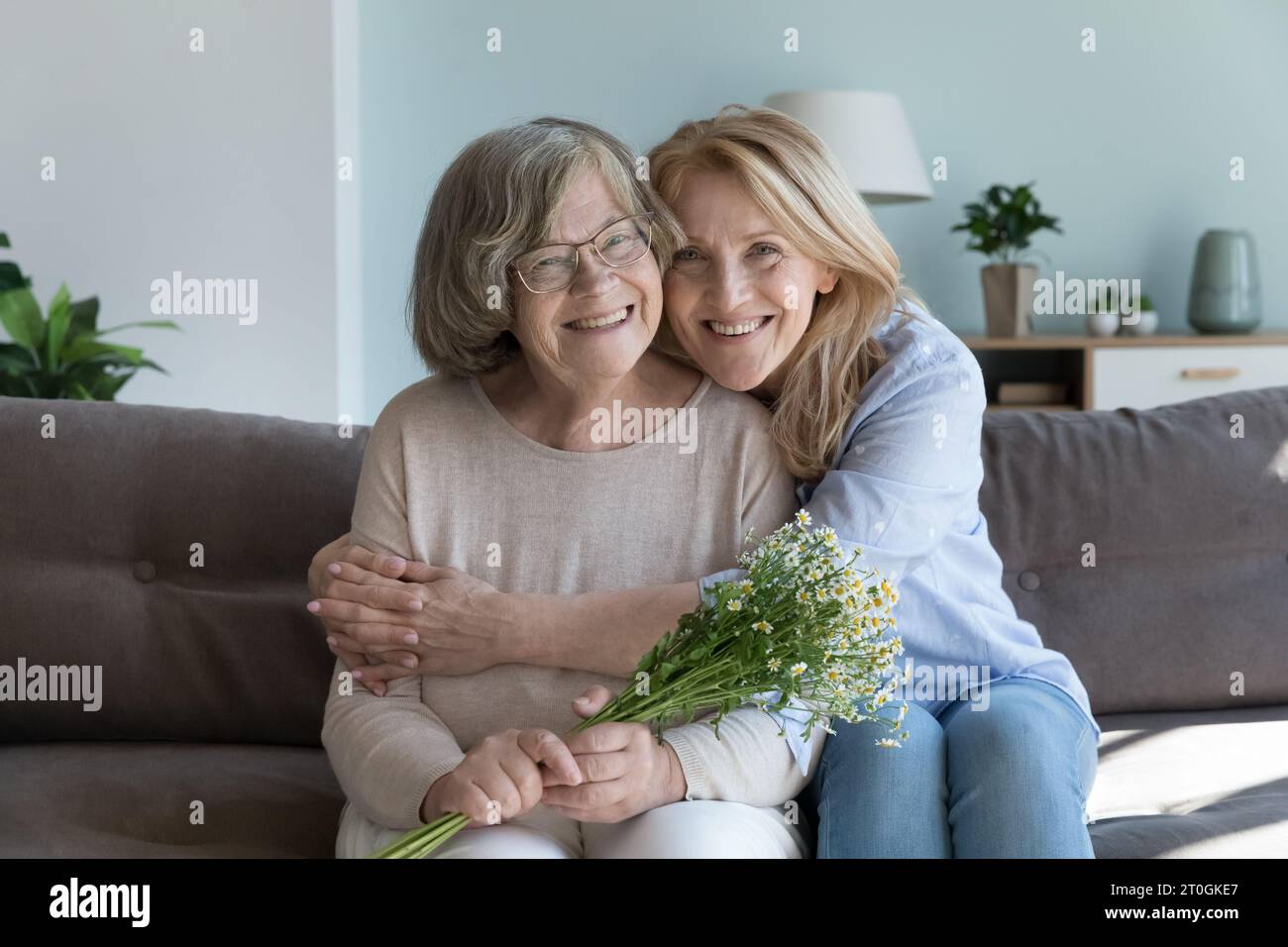 Happy cute elder mom and mature daughter woman hugging Stock Photo - Alamy