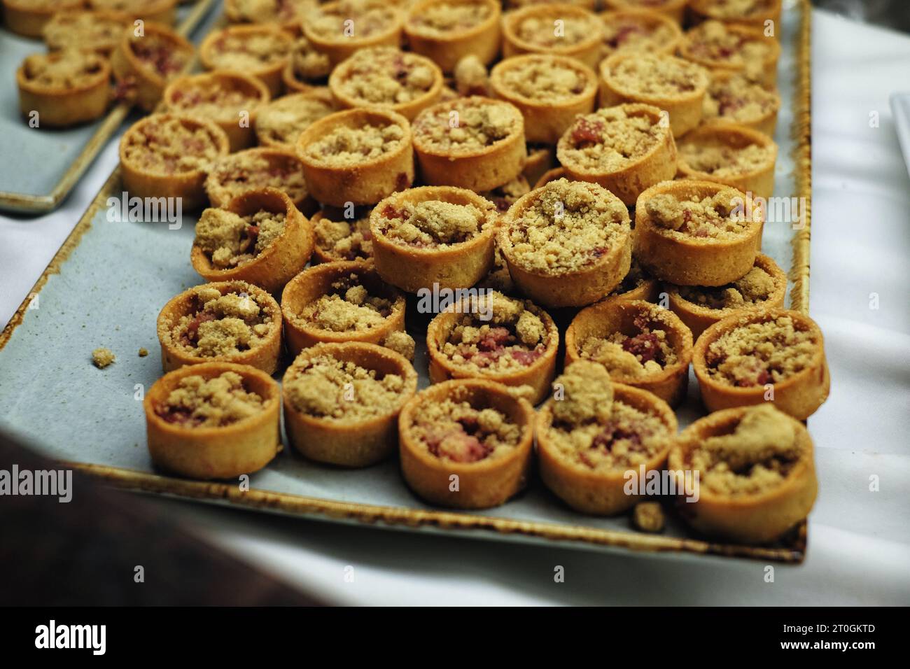 Mini Rhubarb Crumble Tarts Stock Photo - Alamy