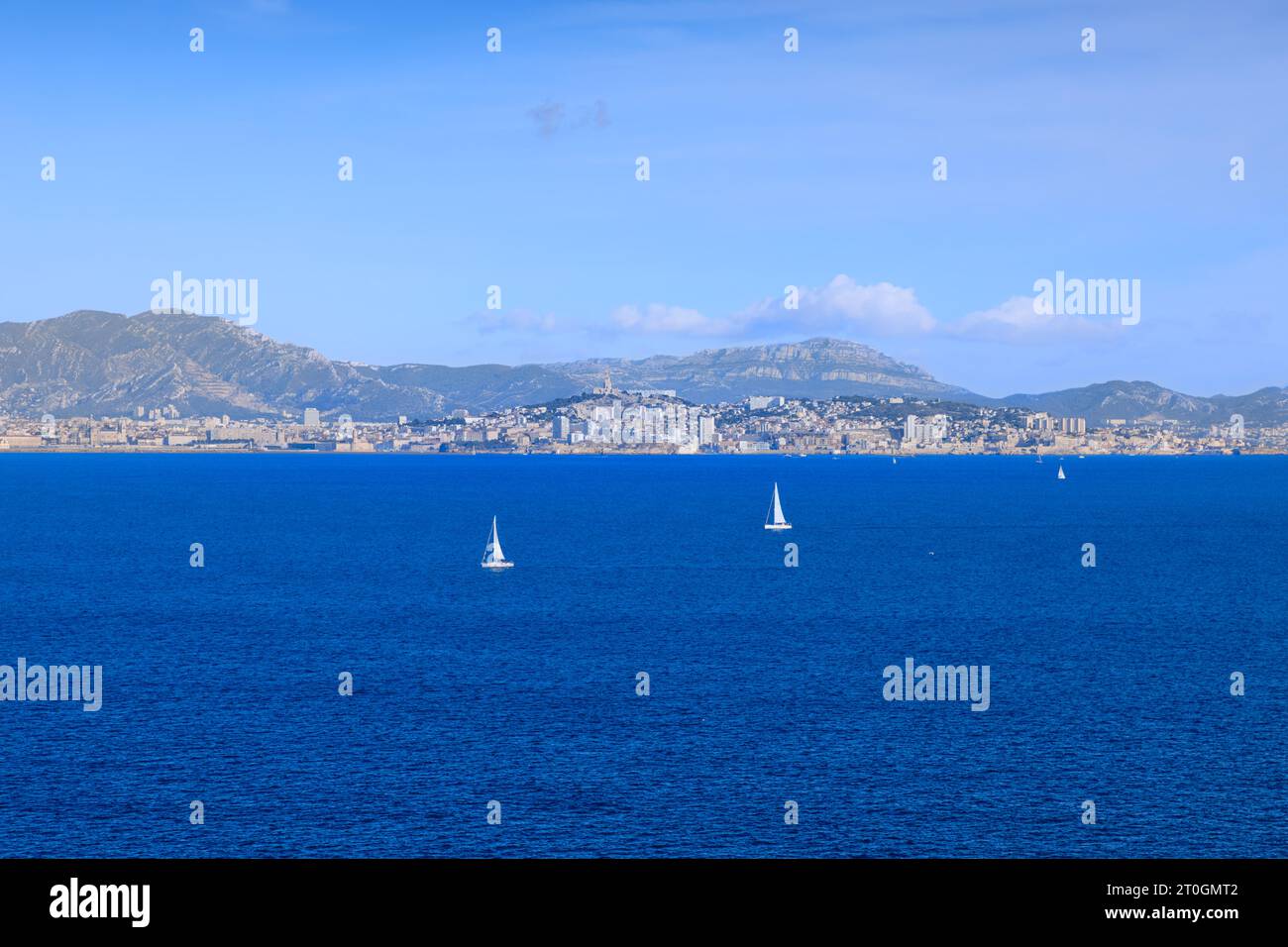 Skyline of Marseille from sea, France. In the distance the silhouette ...