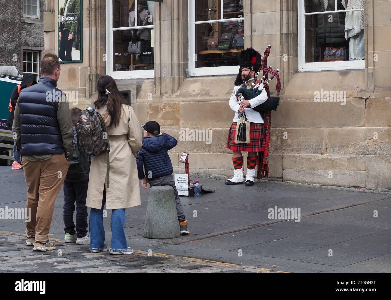 EDINBURGH, UK - SEPTEMBER 15, 2023: Bagpipe player busking on the Royal ...
