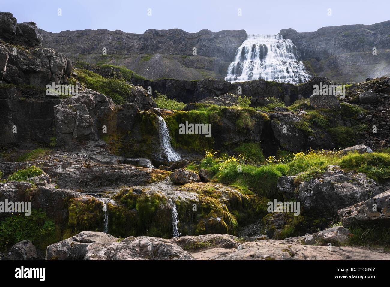 Dynjandi waterfall in iceland cascades behind a series of small ...