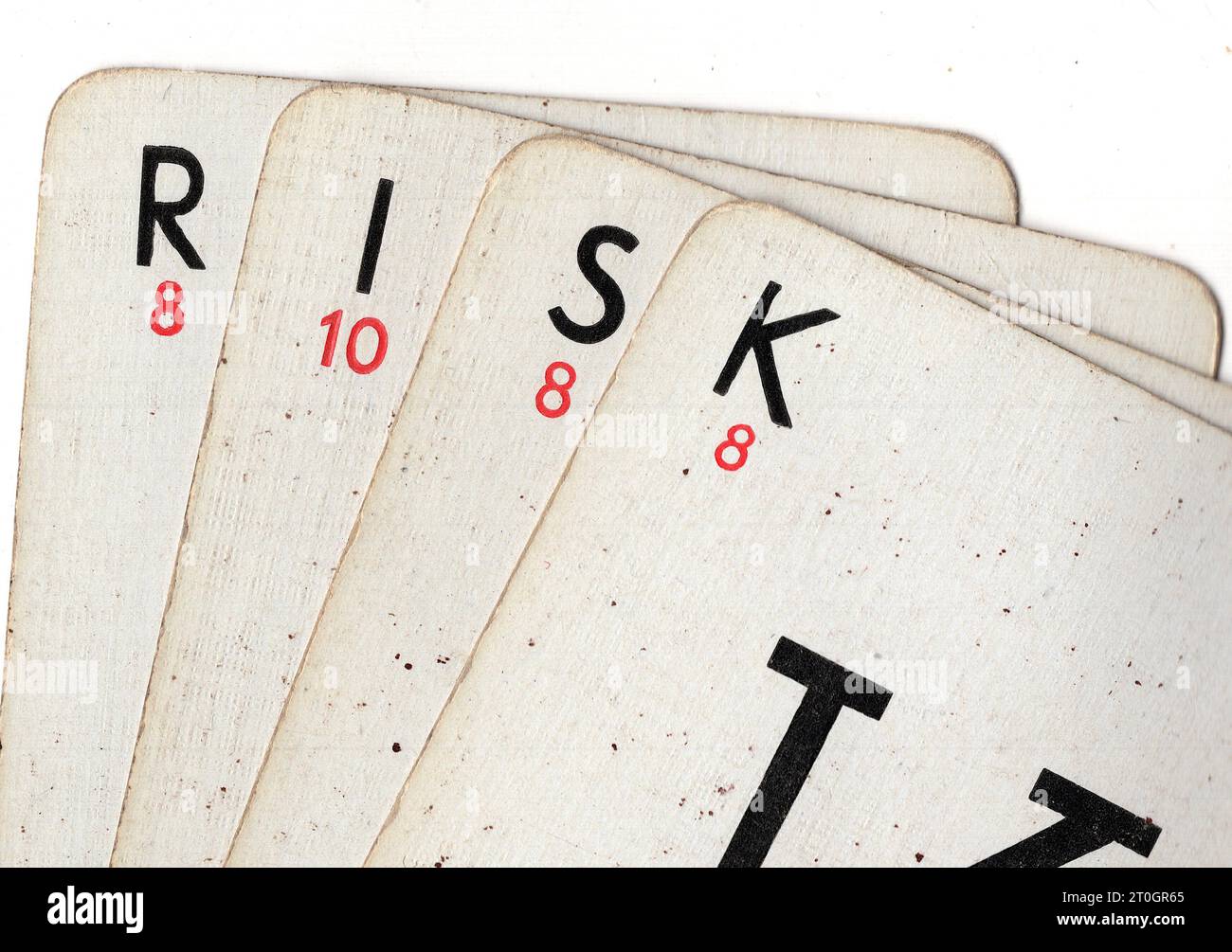 Vintage Lexicon playing cards spelling the word RISK on a white ...