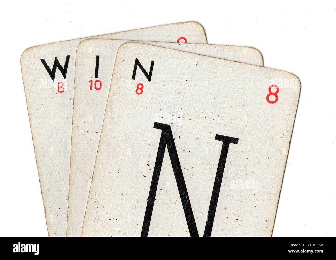 Vintage Lexicon playing cards spelling the word WIN on a white ...