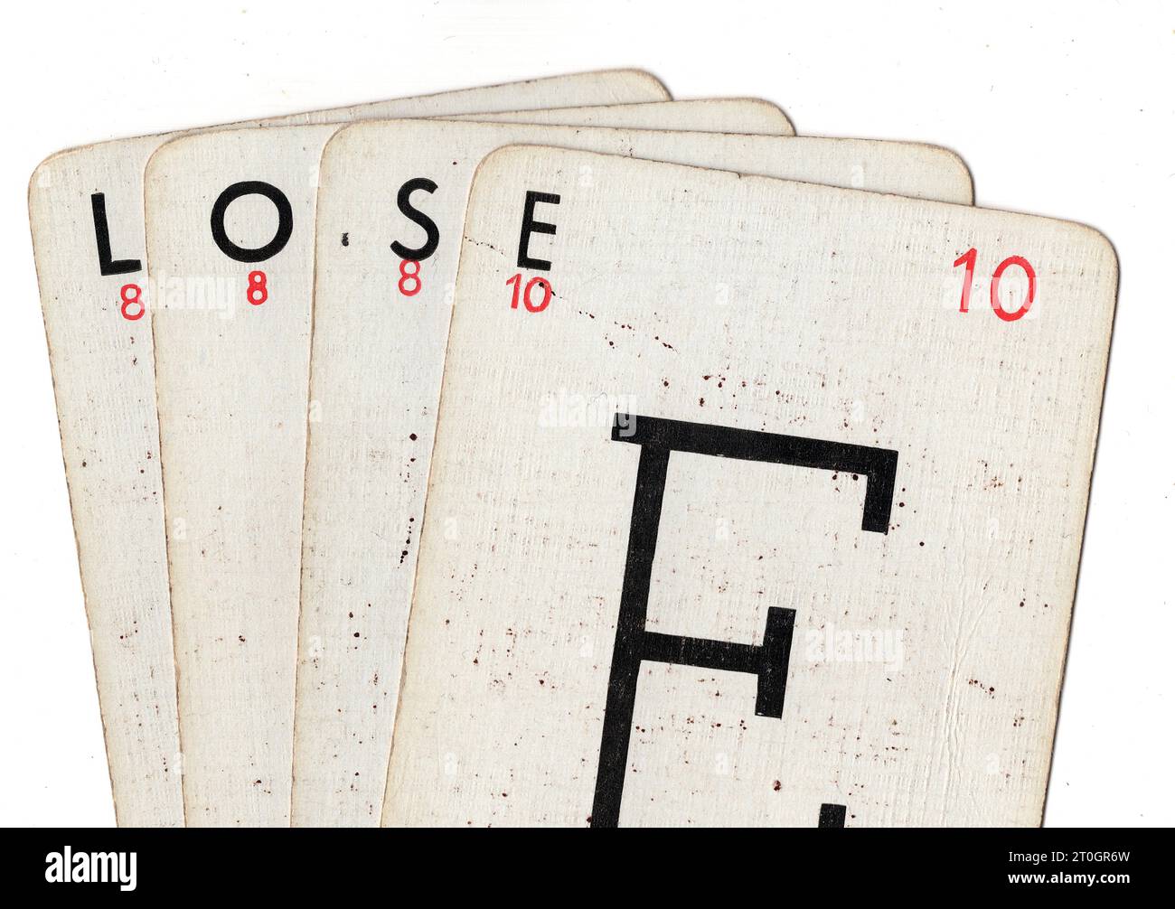 Vintage Lexicon playing cards spelling the word LOSE on a white ...