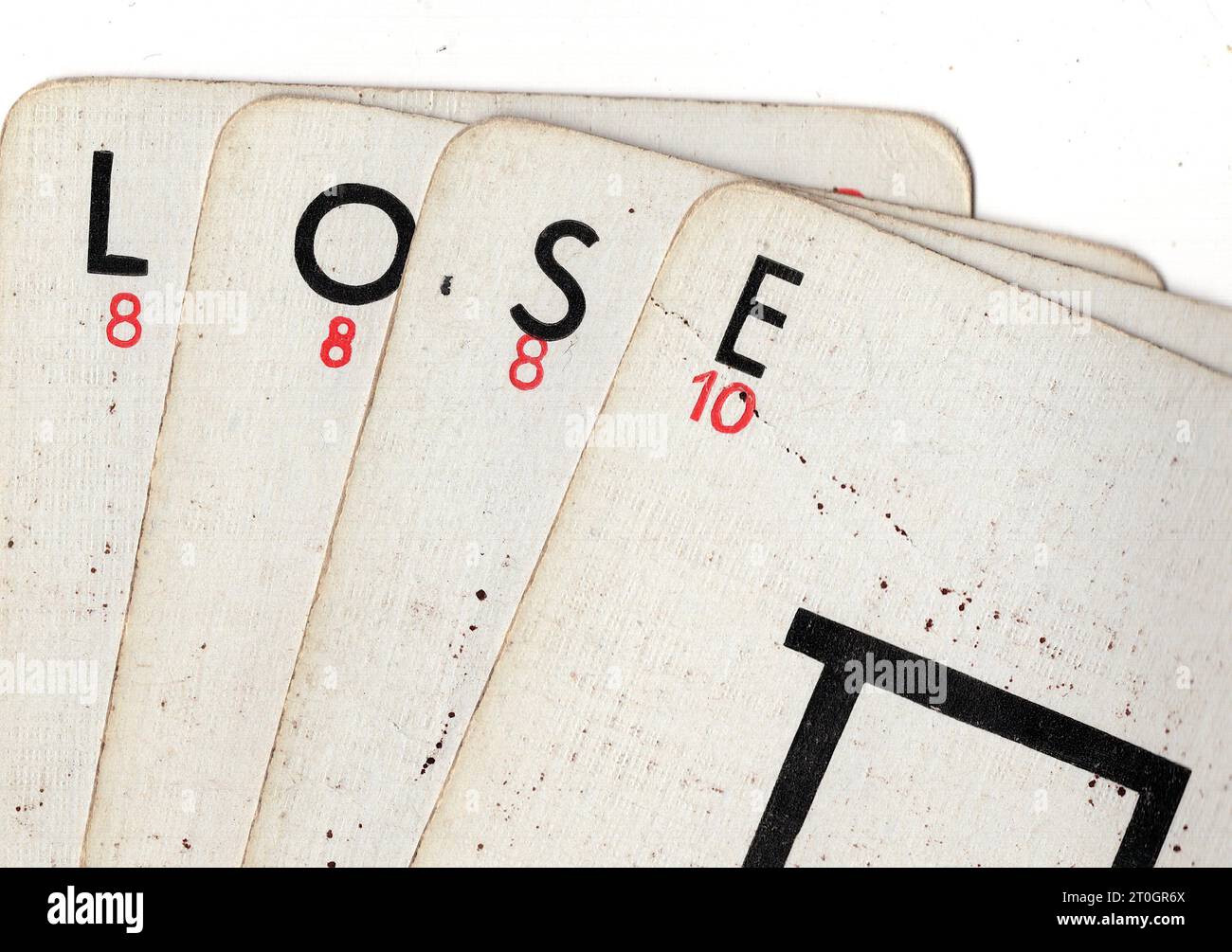 Vintage Lexicon playing cards spelling the word LOSE on a white ...