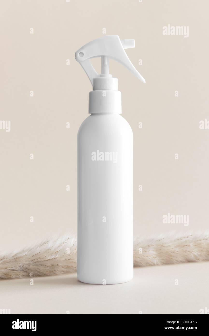 White cosmetic trigger sprayer bottle mockup on the soft yellow ...