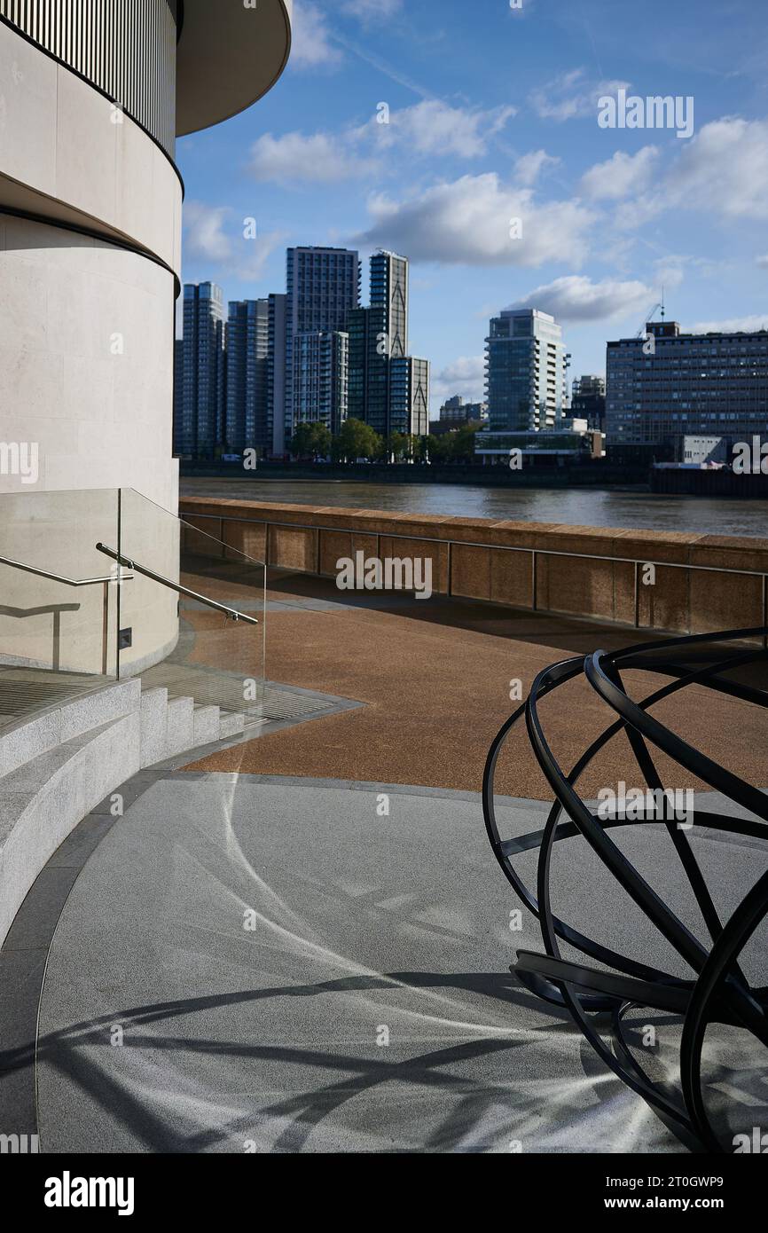 View of urban city scape in sunshine in front of river Stock Photo - Alamy