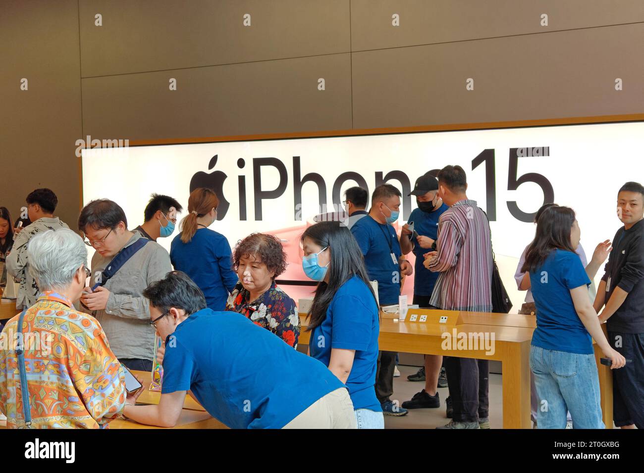 SHANGHAI, CHINA - OCTOBER 7, 2023 - Customers experience an iPhone15 at an Apple store in ...