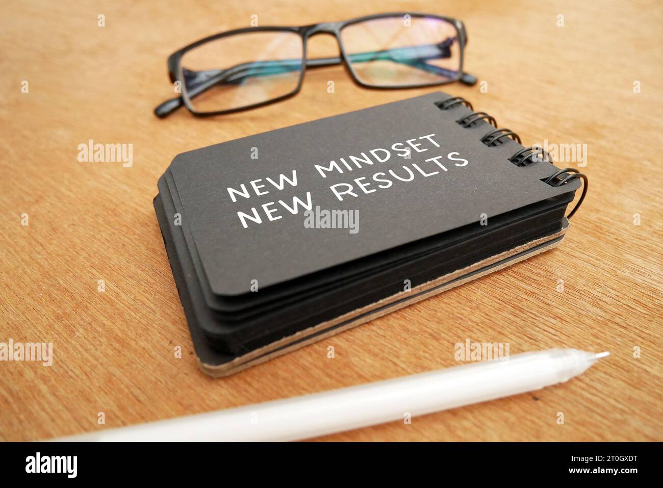 Black spiral notebook and text new mindset new results with aesthetic ...