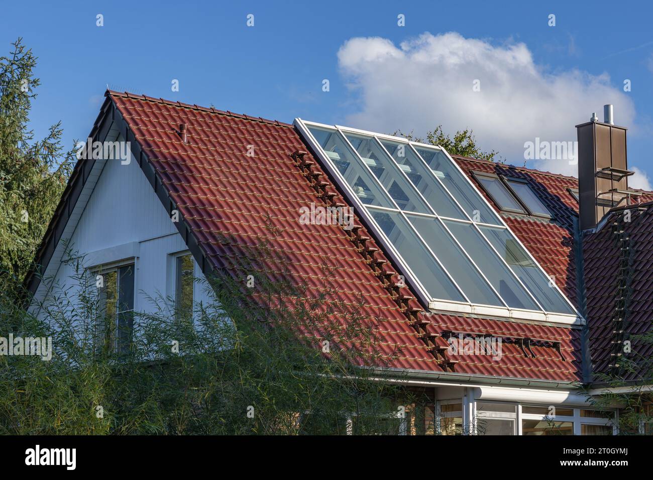 Detached house with a gable roof and large skylight Stock Photo - Alamy