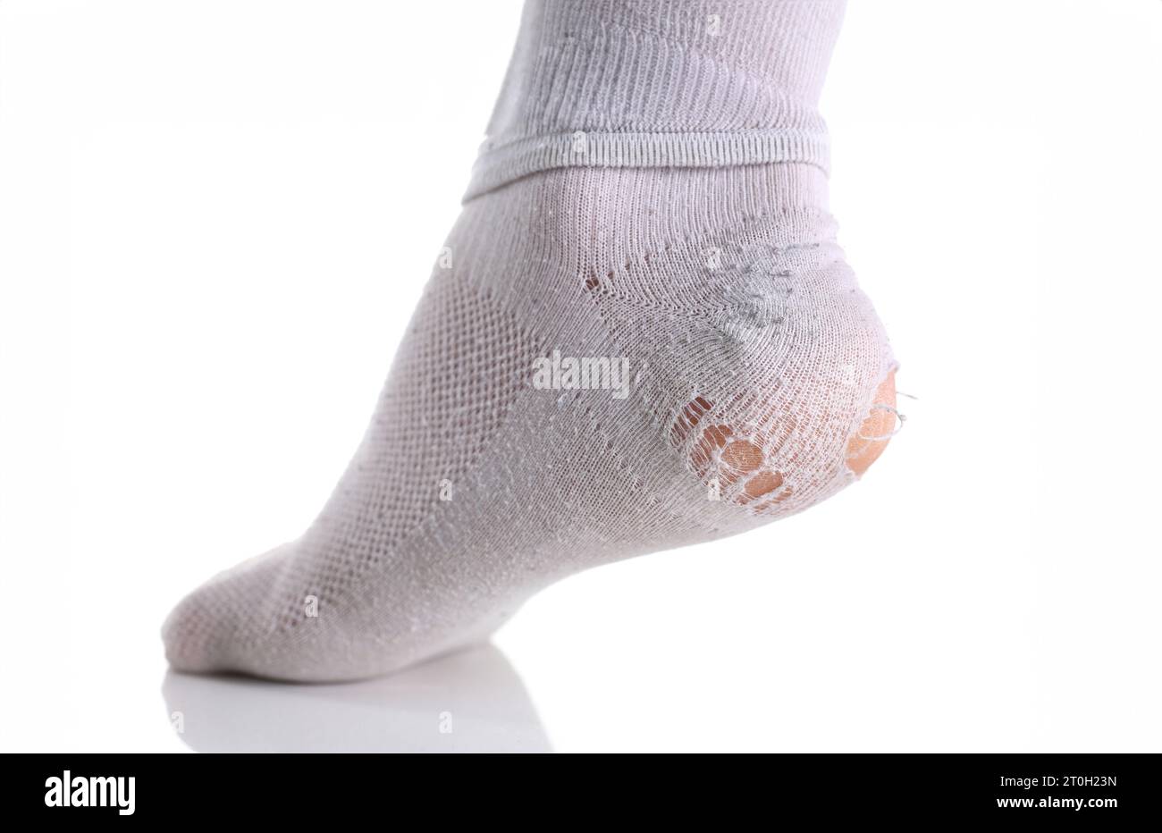 Ripped white sock on male leg isolated Stock Photo - Alamy