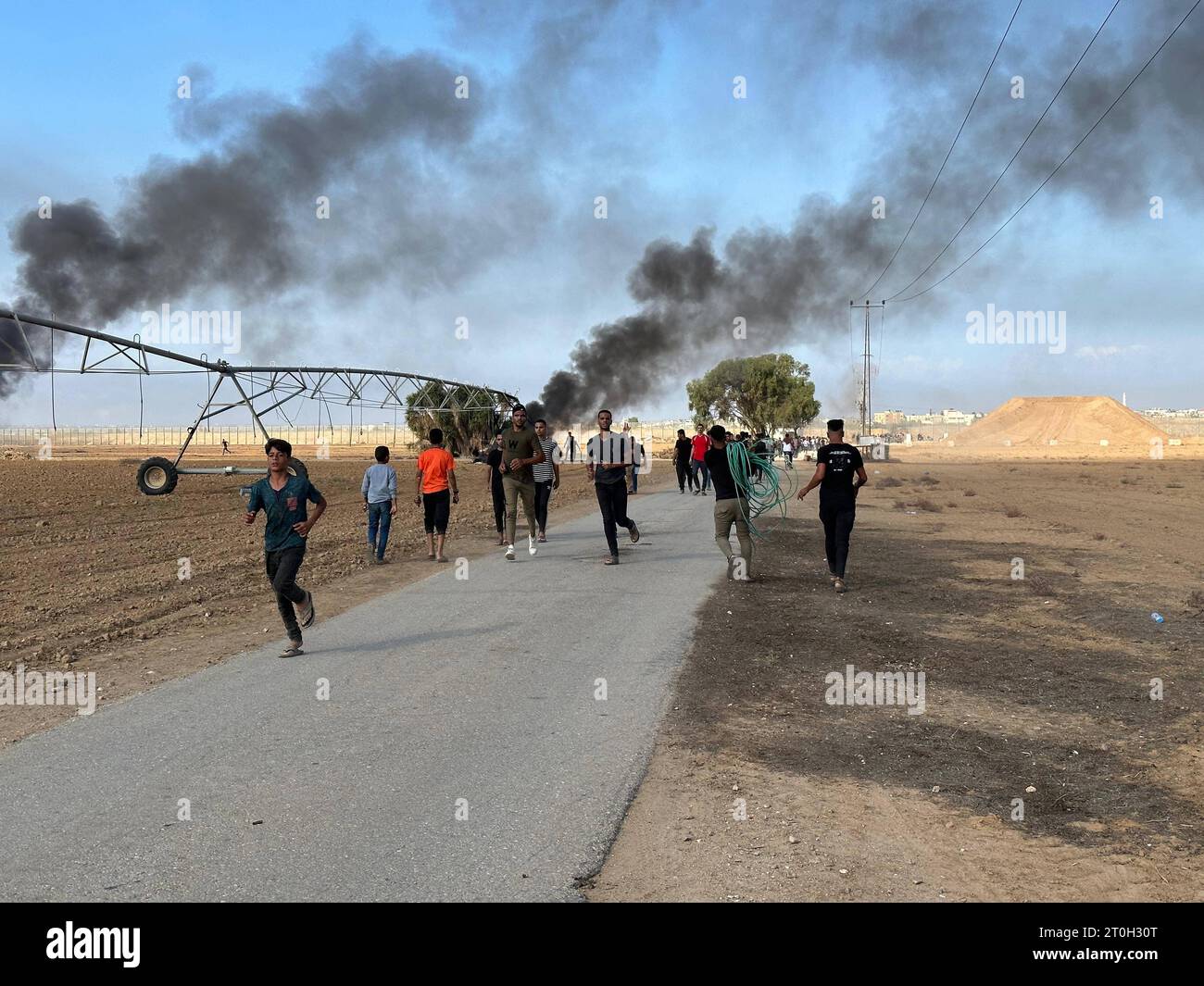 Palestine. 07th Oct, 2023. Palestinians crossing the border fence with ...