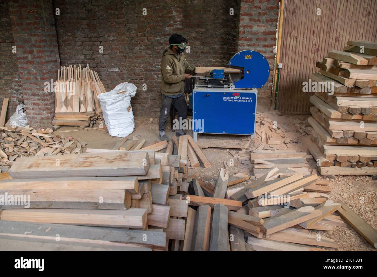 Kashmir, India. 2nd Oct, 2023. A worker shapes willow cleft used to ...