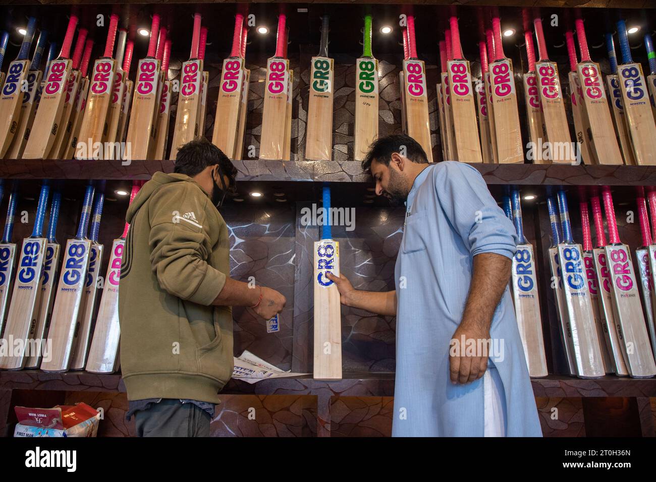 Kashmir, India. 2nd Oct, 2023. Owner of GR8 sports bat factory (R ...
