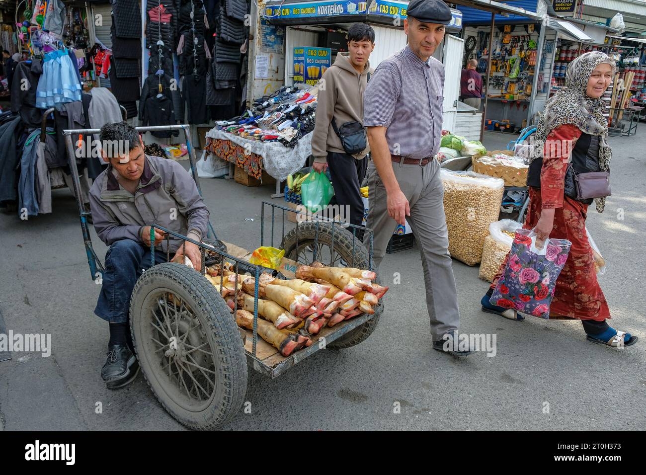 Osh, Kyrgyzstan - October 6, 2023: A man selling cow legs at the Jayma ...