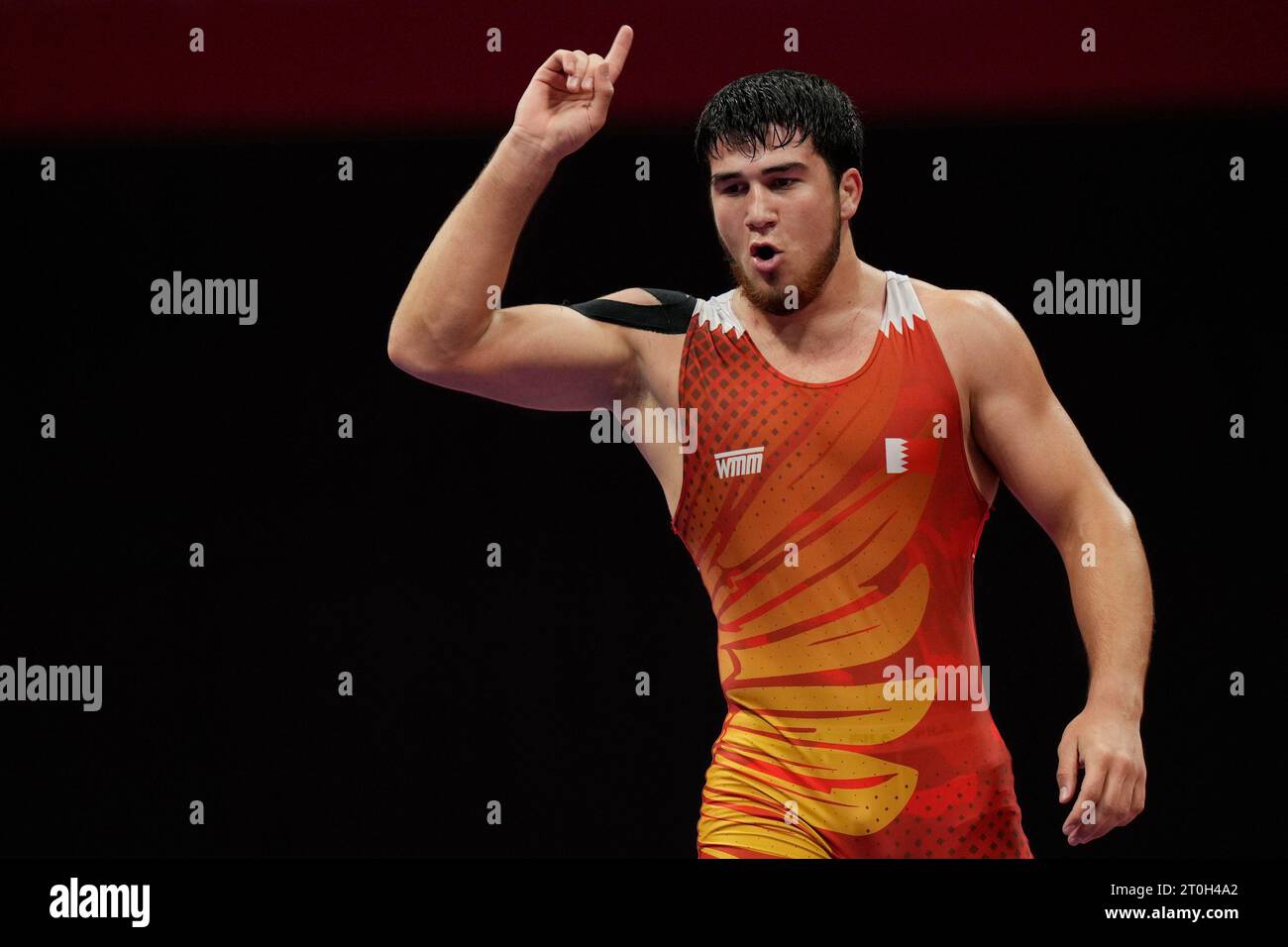 Bahrain's Akhmed Magomed O. Tazhudinov celebrates after defeating Iran ...