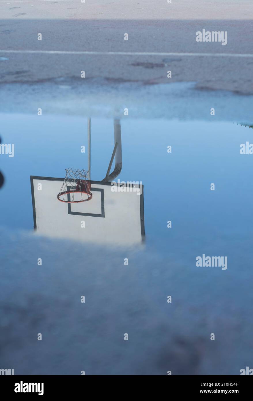 The basketball ring is reflected in the water. spor, activity concept ...
