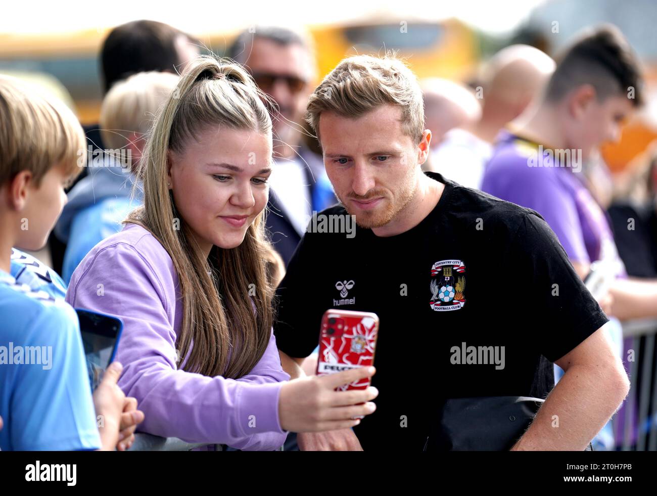 Coventry City's Jamie Allen poses for a photo with a fan ahead of the ...