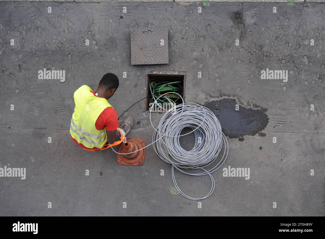 Milan (Italy), optical fiber cable laying Stock Photo - Alamy