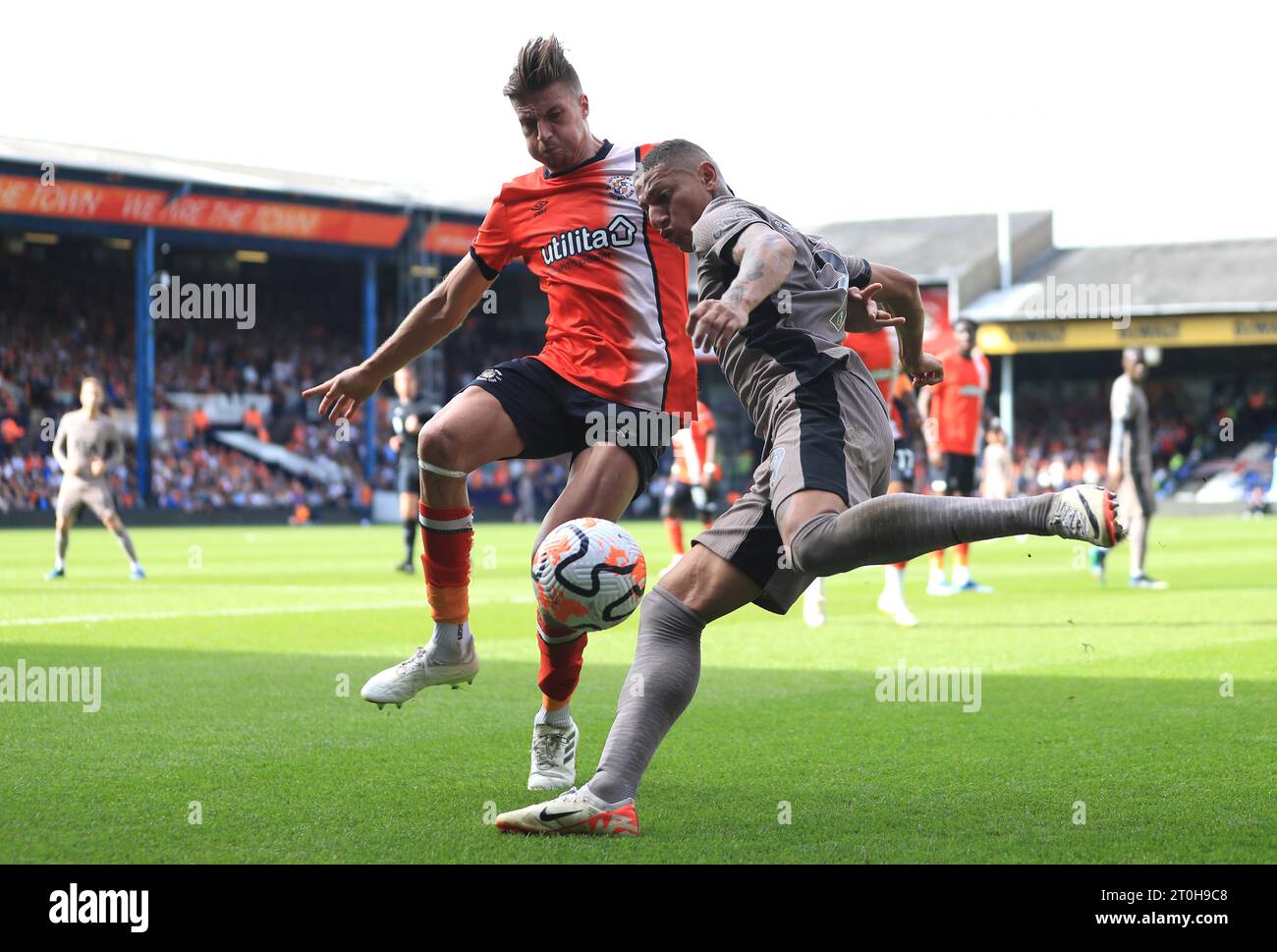 Tottenham Hotspur's Richarlison (right) and Luton Town's Reece Burke ...
