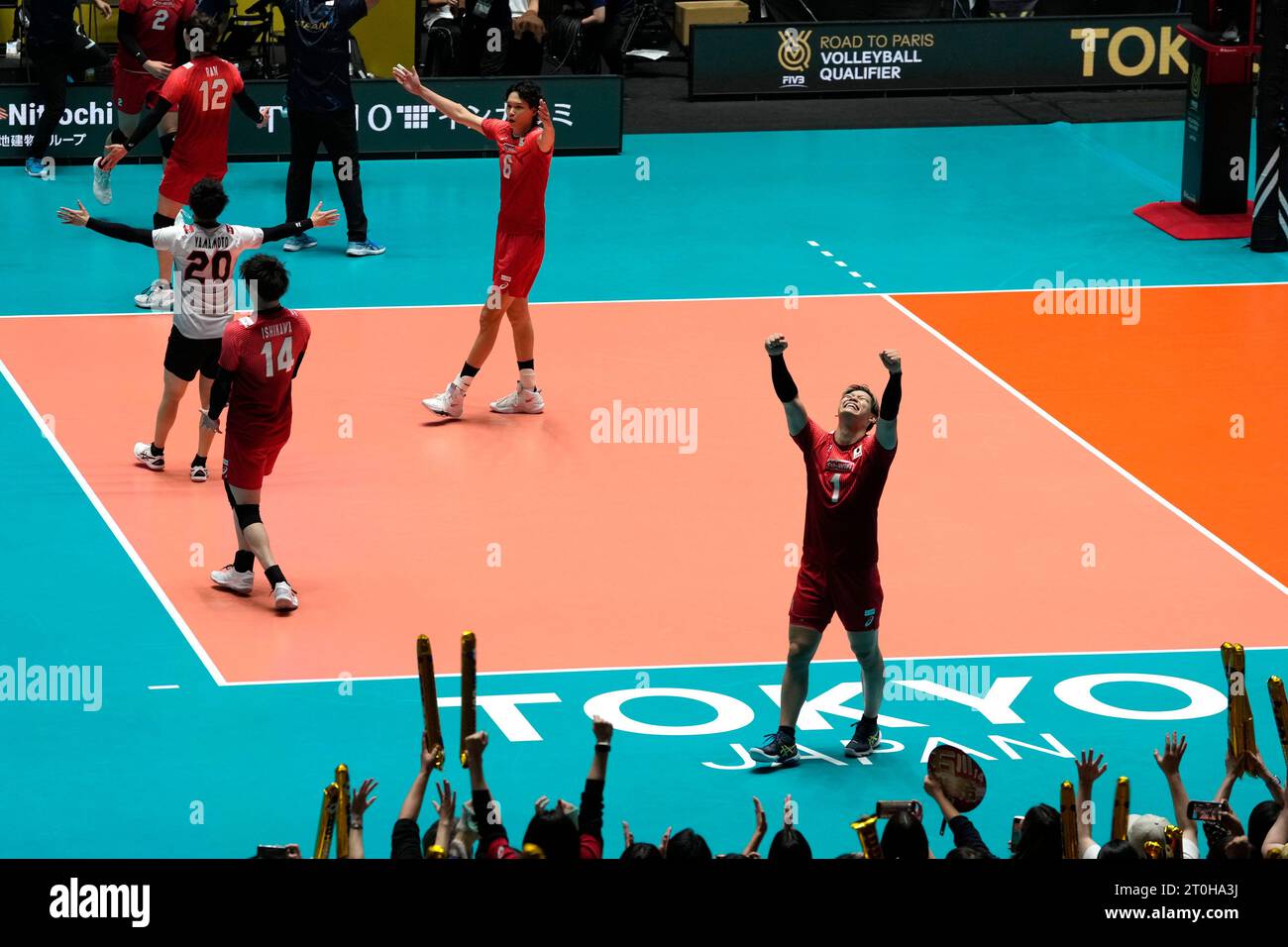 Yuji Nishida, front, of Japan and his teammates celebrate as the team ...