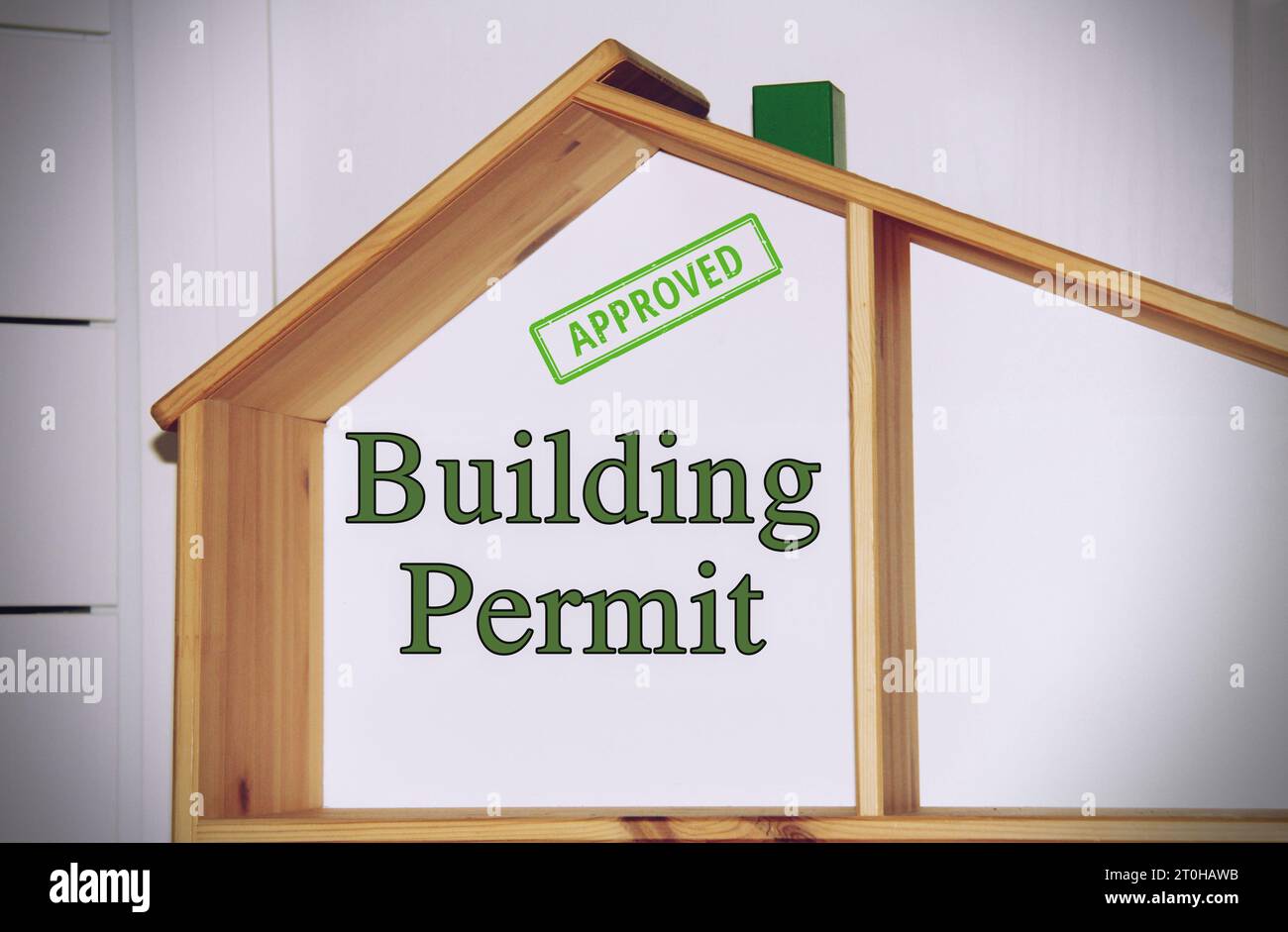 House model with the text “Building permit” , and the stamp approved ...