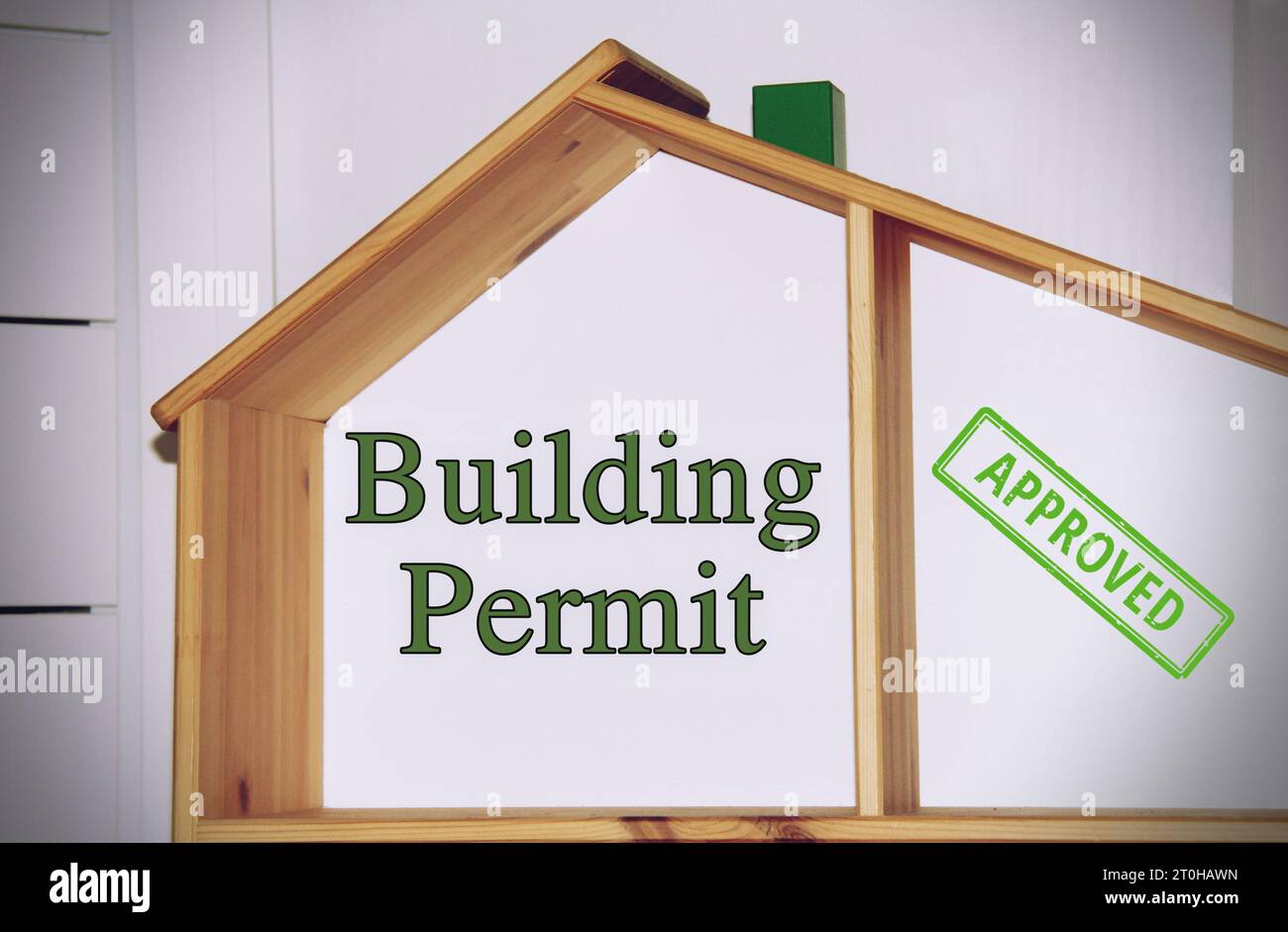 House model with the text “Building permit” , and the stamp approved ...